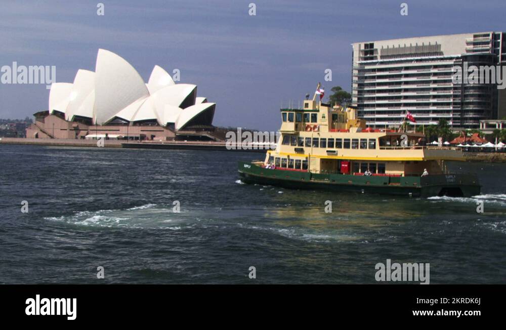 Ferry passes Sydney opera house Stock Video Footage - Alamy