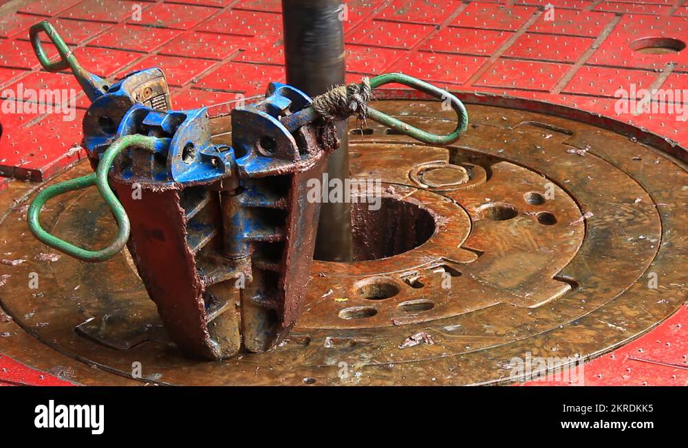 Slip on the rotary table while drilling oil well and pipe being rotated ...