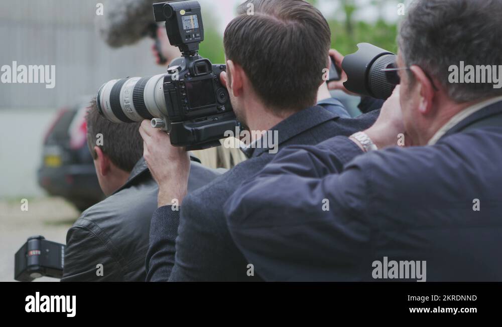 Glamorous model poses for the cameras as paparazzi fight to get the ...