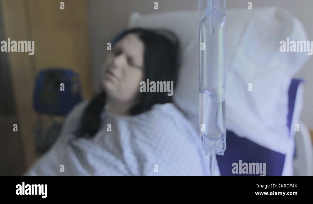 Hospital patient with drip in hospital bed Stock Video Footage - Alamy