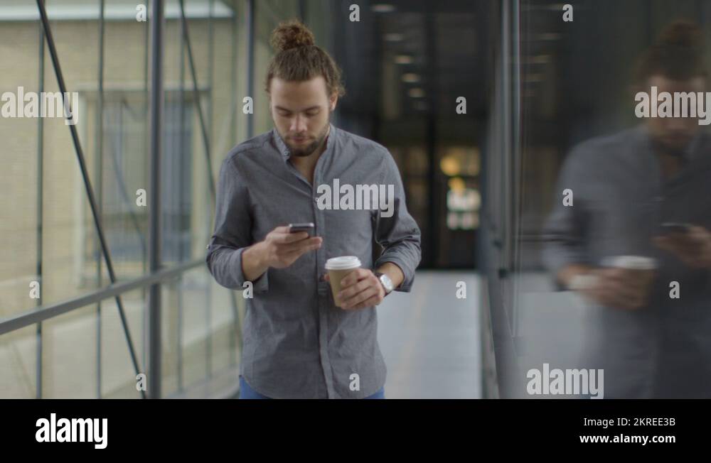 Man standing using phone Stock Videos & Footage - HD and 4K Video Clips ...