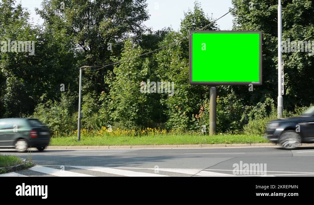 billboard - green screen - urban street with passing cars and nature ...