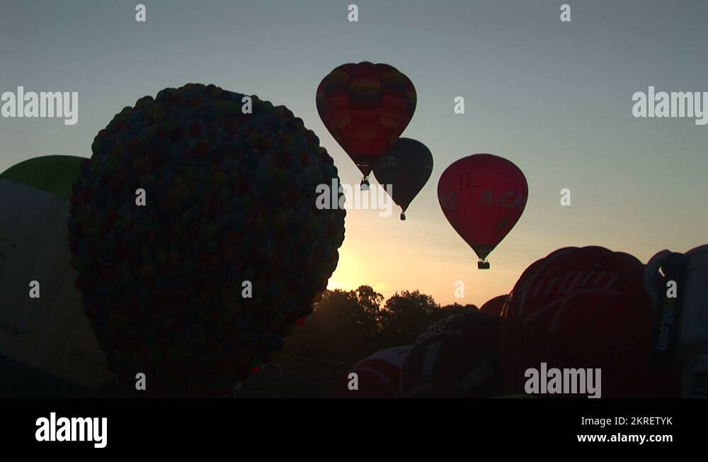 Hot air balloons taking off in silhouette Stock Video Footage - Alamy