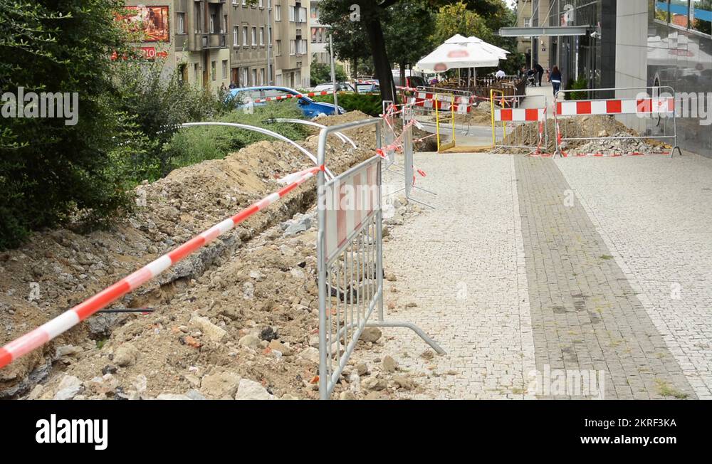 repair the urban street - pavement - cars with building and people in ...
