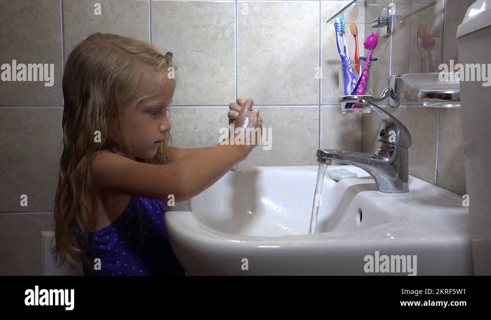 Child, Little Girl, Washing Hands with Soap, Water in Bathroom Sink ...