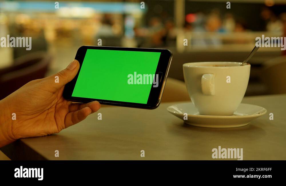 tablet phone with green screen - isolated display - cafe cafeteria ...