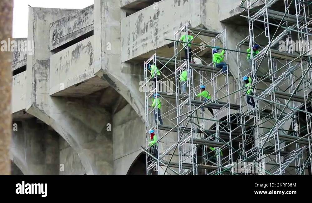 Thai construction workers on scaffolds Stock Video Footage - Alamy