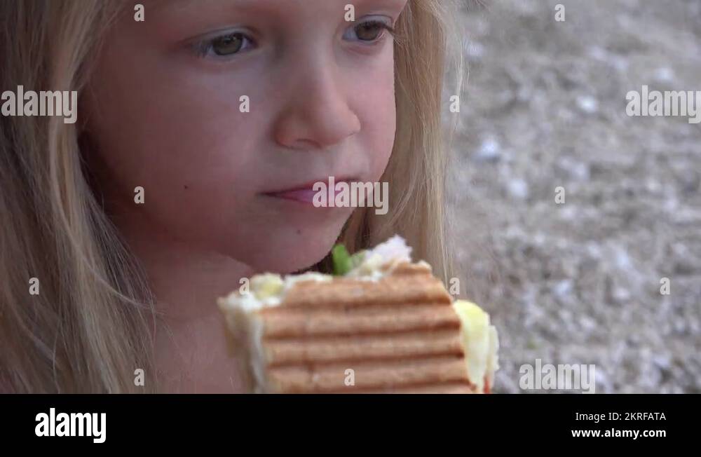 4K Little Girl Eating Sandwich, Snack, Child, Kid Eats Toast Breakfast Close up Stock Video ...