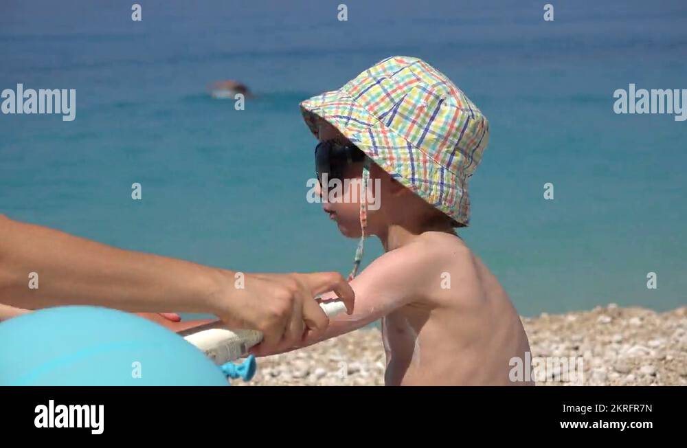 Mother hand spray sun cream on little baby, suntan lotion Stock Video ...