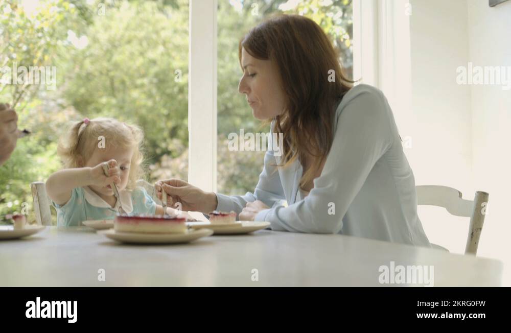 Family eating cake Stock Video Footage - Alamy
