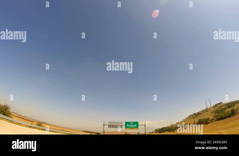 driving on highway/interstate, exit sign of the city of atlanta, gorgia ...