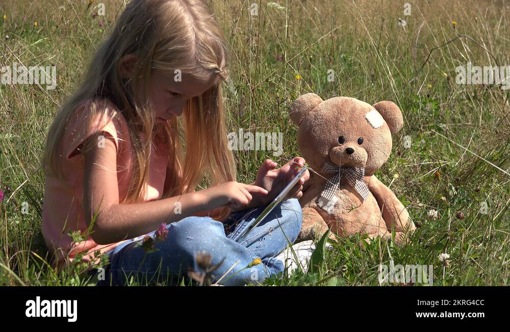 4K Child Playing Typing Tablet in Park, Little Girl Using Ipad PC ...