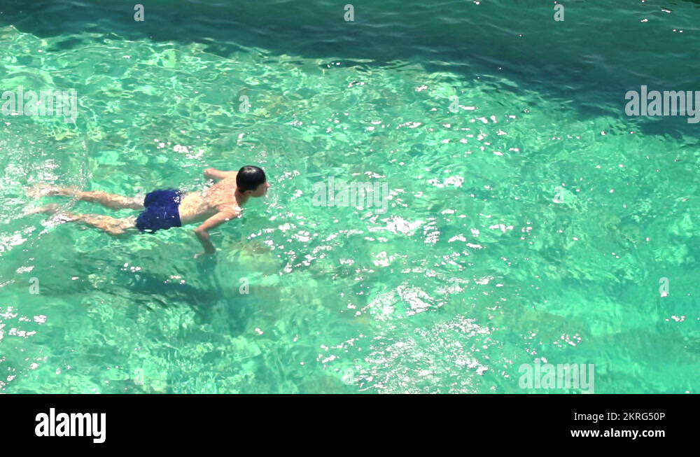 Young boy swimming in the swimming pool, top view HD Stock Video ...