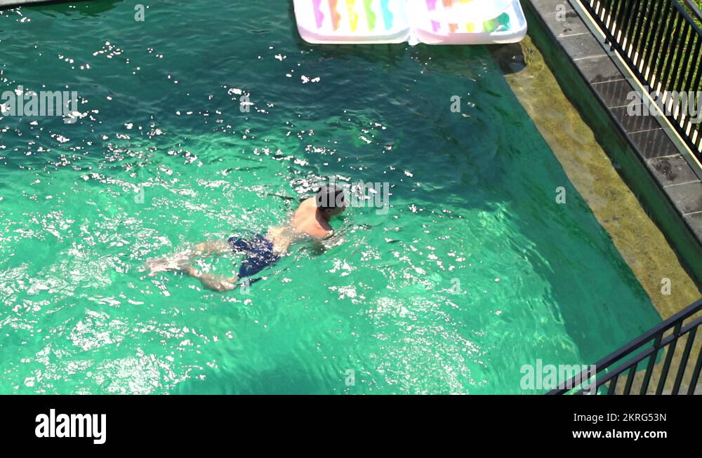 Young boy swimming in the swimming pool, top view HD Stock Video ...