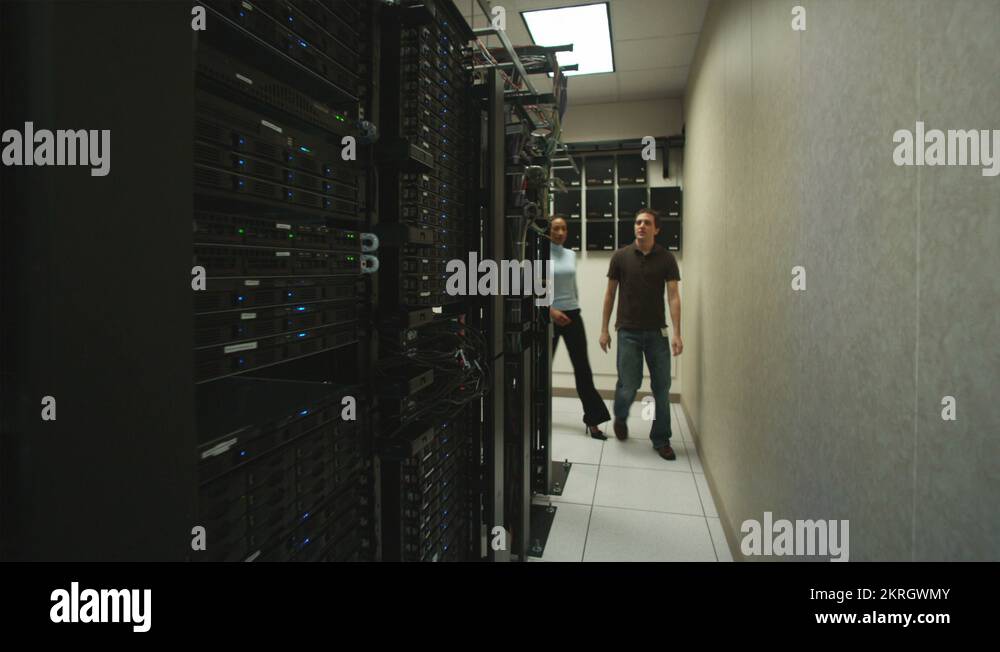 two people in a server room Stock Video Footage - Alamy
