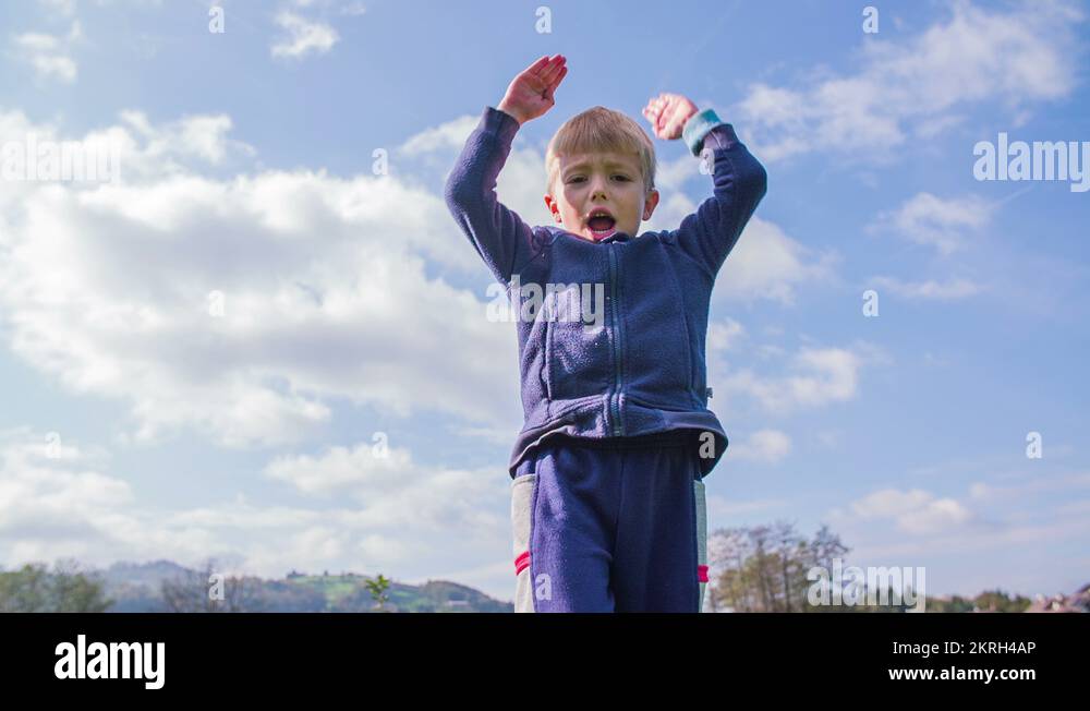 Kid waving at sky Stock Videos & Footage - HD and 4K Video Clips - Alamy