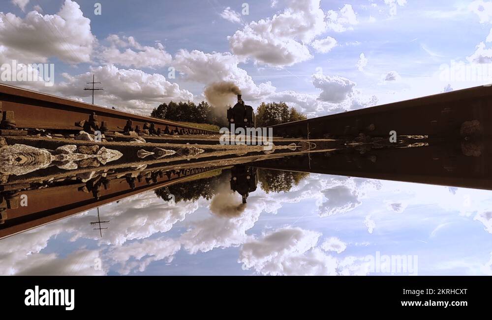 steam engine train locomotive driving over camera. mirror reflection ...