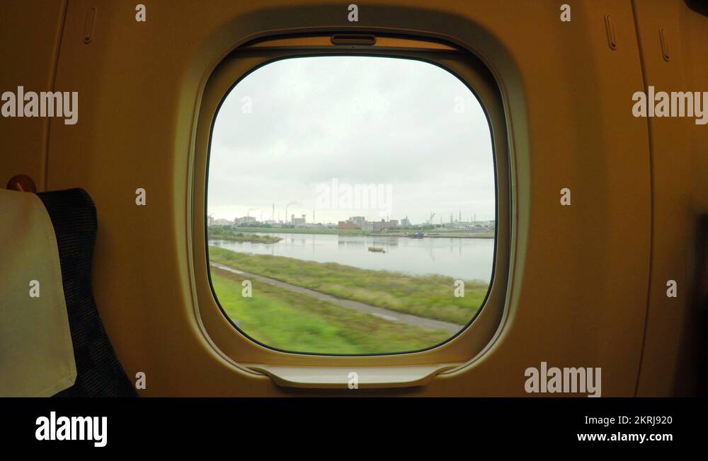 Looking through the window onboard a high speed train in Japan ...
