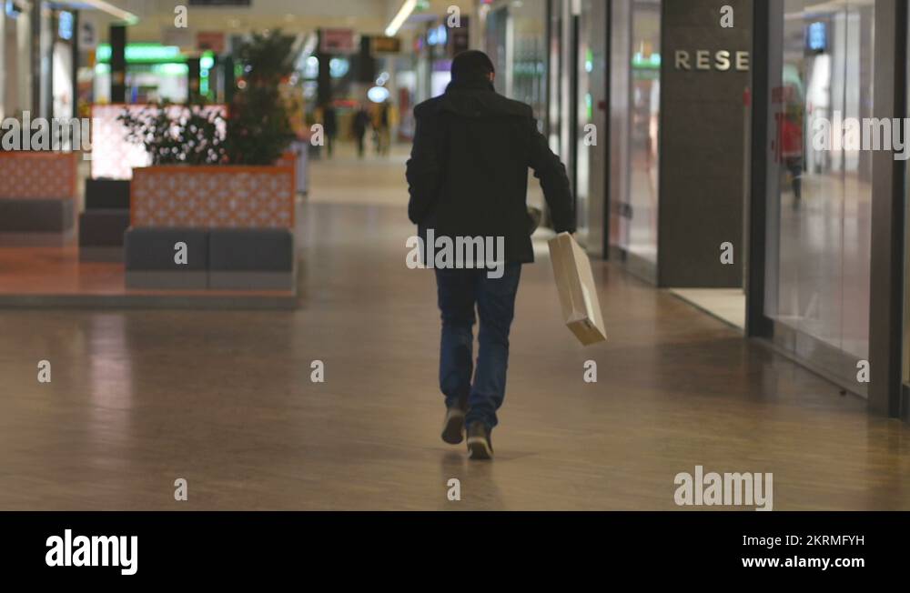 Man running in mall Stock Videos & Footage - HD and 4K Video Clips - Alamy