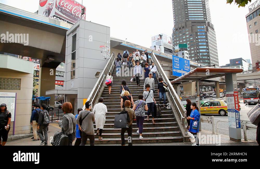 Crowd of people cross intersection on a busy street of Tokyo, Japan ...