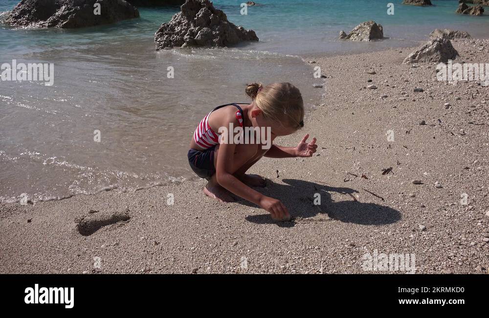 4K Little Girl Drawing, Playing in Sand Beach, Child Bathing in Sea ...