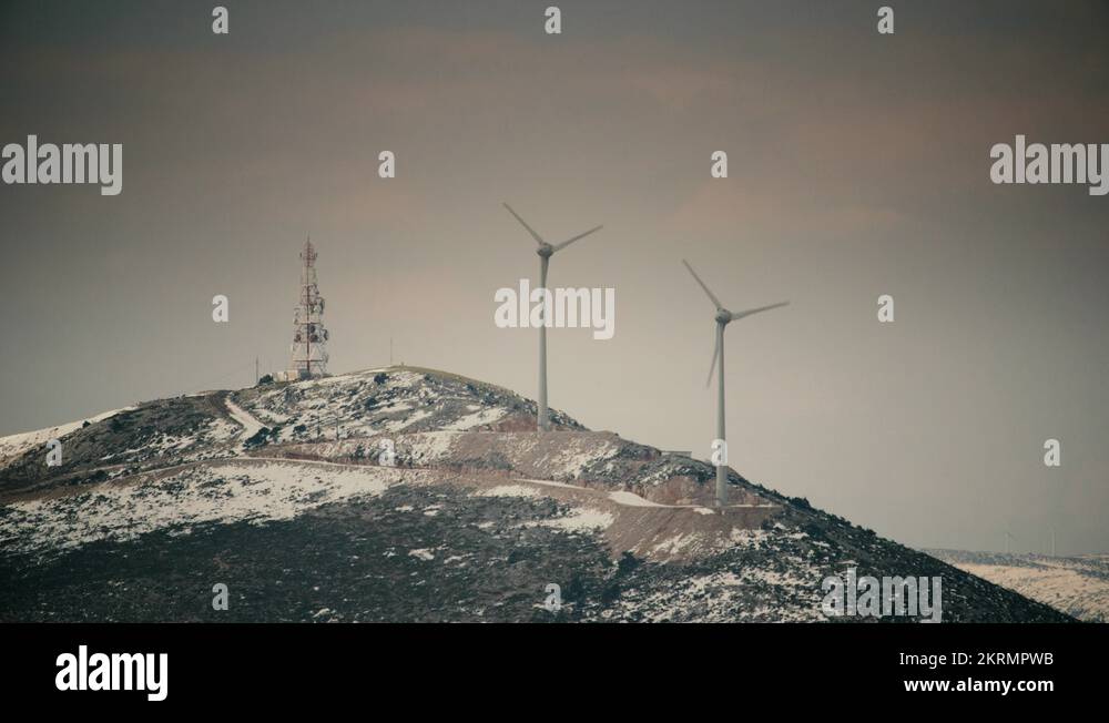 Wind mill turbines blades rotating generating power on mountain long ...