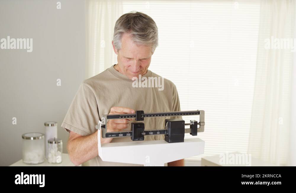 Happy man scale Stock Videos & Footage - HD and 4K Video Clips - Alamy