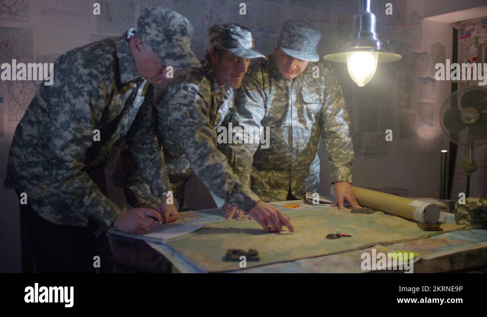 4K Military officers in army bunker, looking at map & discussing battle ... 4K Military officers in army bunker, looking at map & discussing battle ...