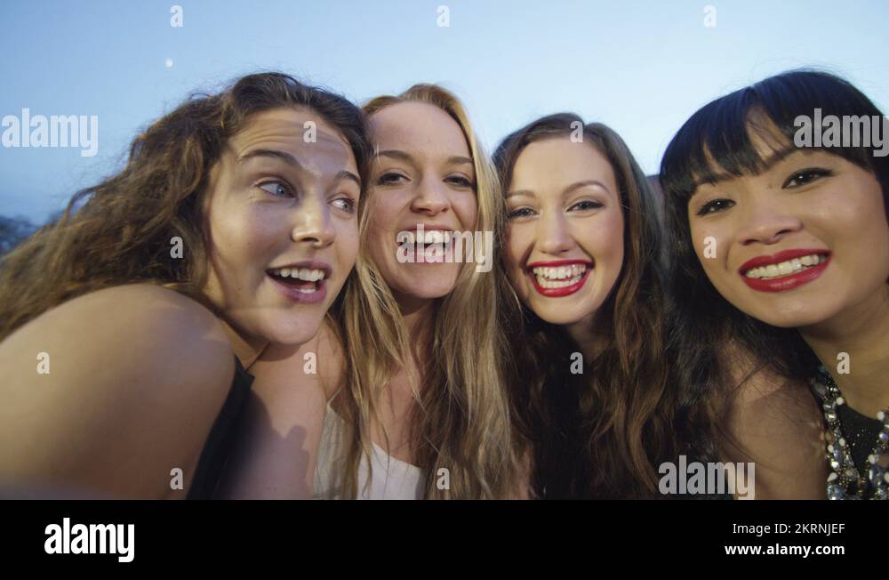 4K Happy diverse group of friends at black tie event, pose to take a ...