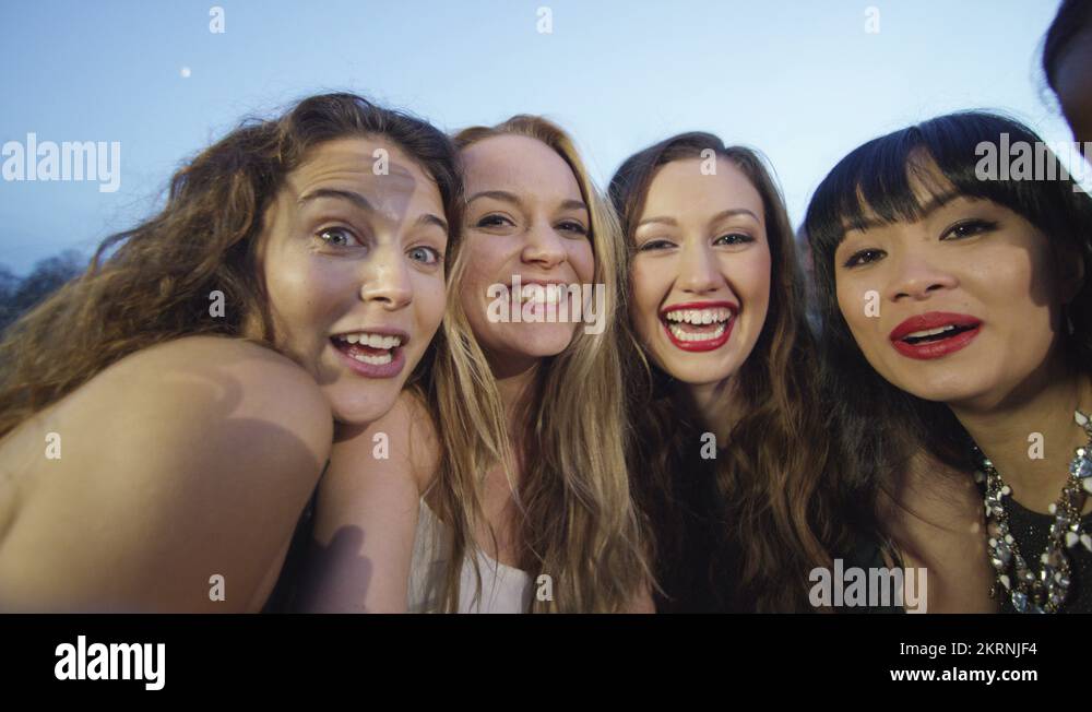 4K Happy diverse group of friends at black tie event, pose to take a ...