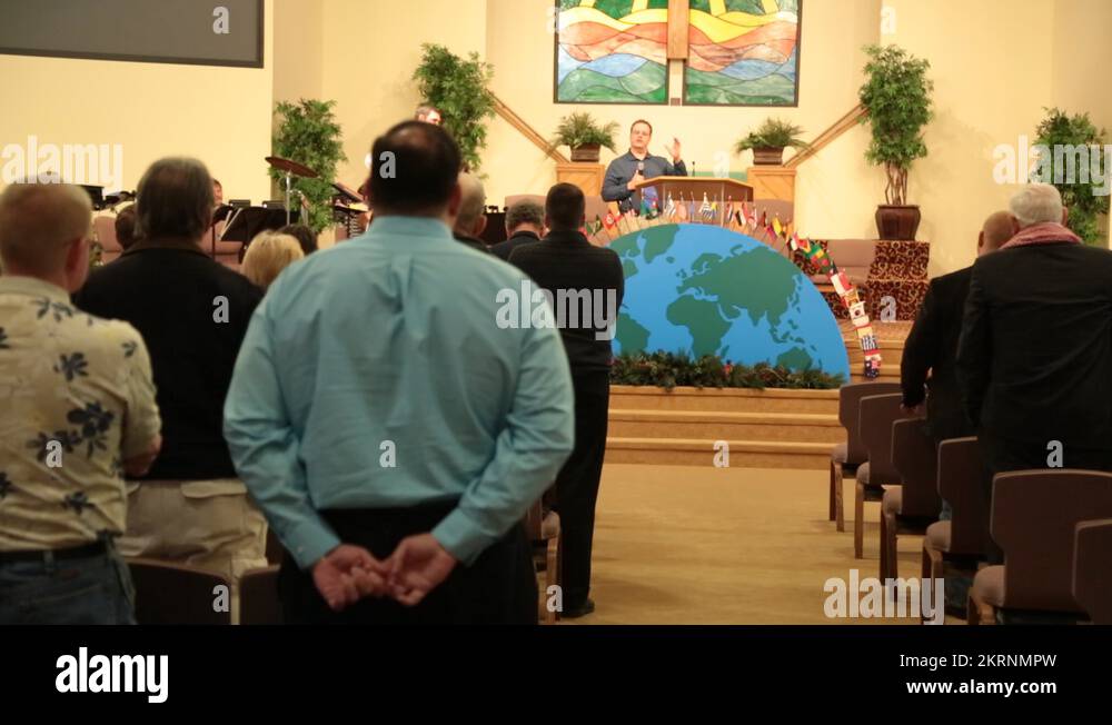 Crowd of people looking at man speaking from church pulpit Stock Video ...