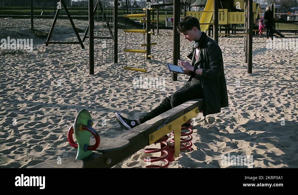 Sitting on seesaw Stock Videos & Footage - HD and 4K Video Clips - Alamy