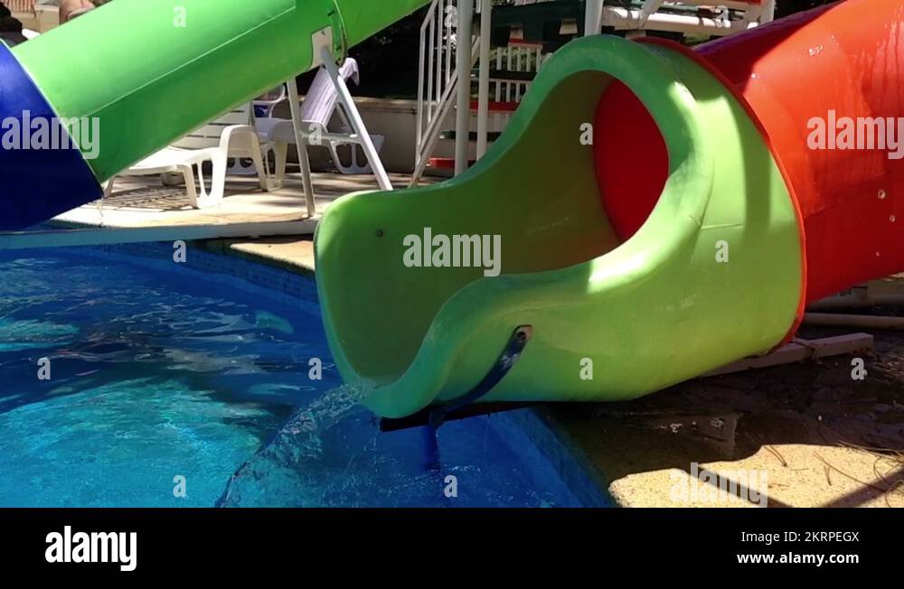 Girl jumping in Swimming Pool from water slide. Kids. Slow Motion HD ...