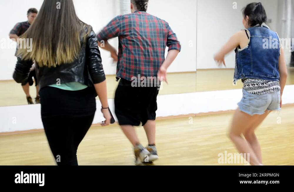 three dancers - group of three friends dance - two women and one man ...
