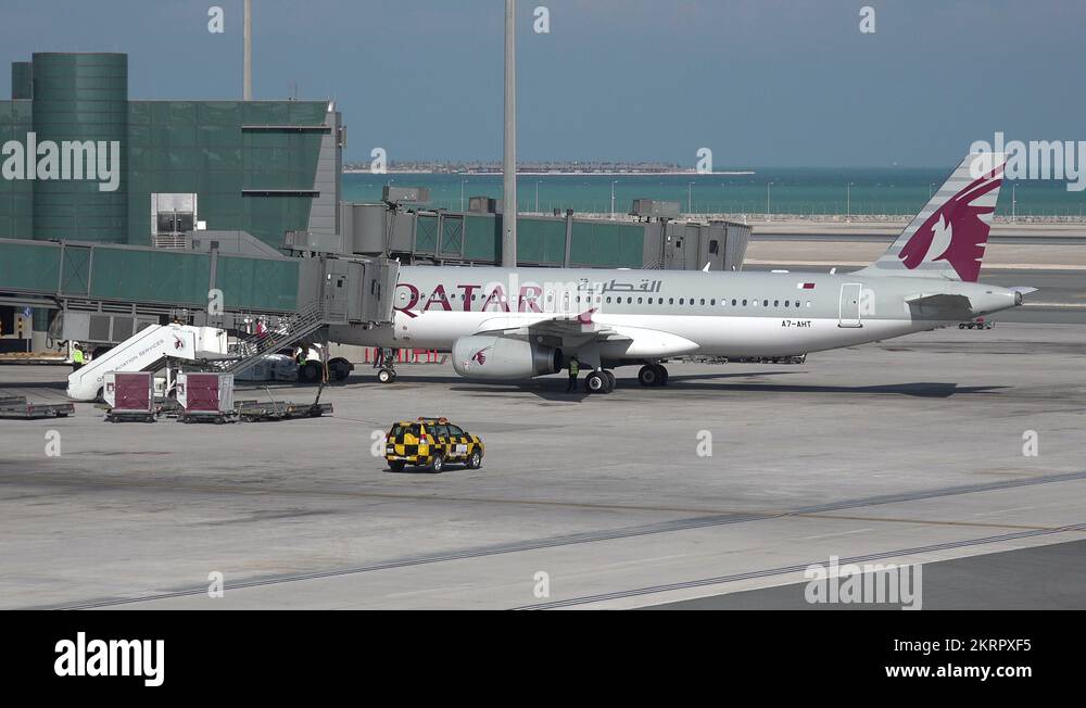 Qatar Airways plane at gate of Hamad International Airport in Doha ...