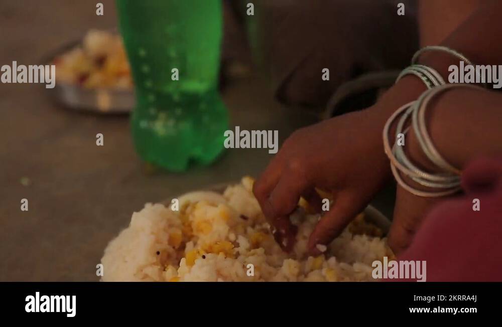 Little Indian girl eating rice with her hands in India Stock Video ...
