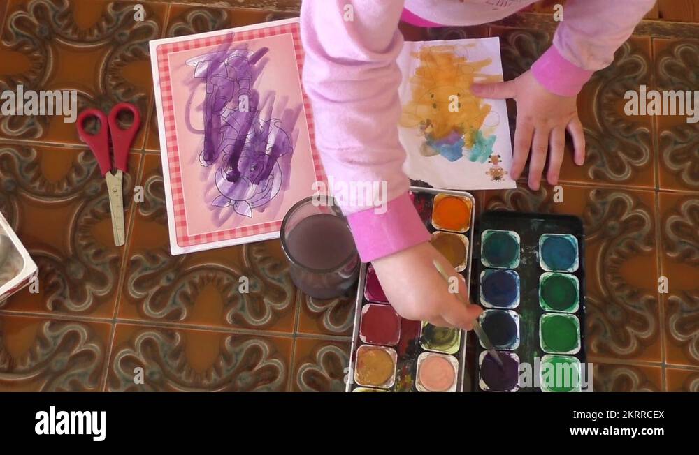 Little child coloring in coloring book Stock Video Footage - Alamy
