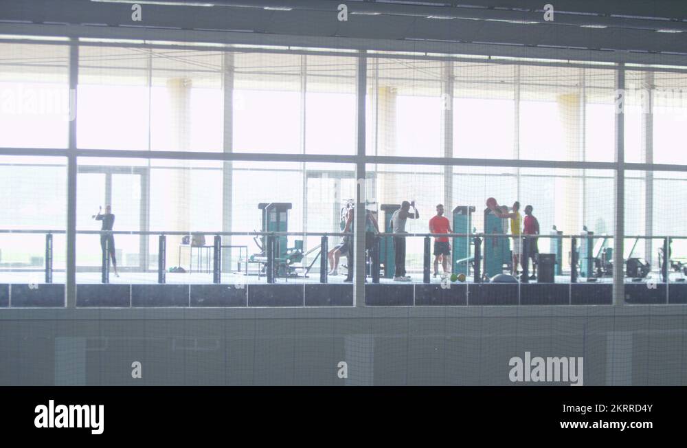 4K Long shot of all male sports team or gym buddies training together ...