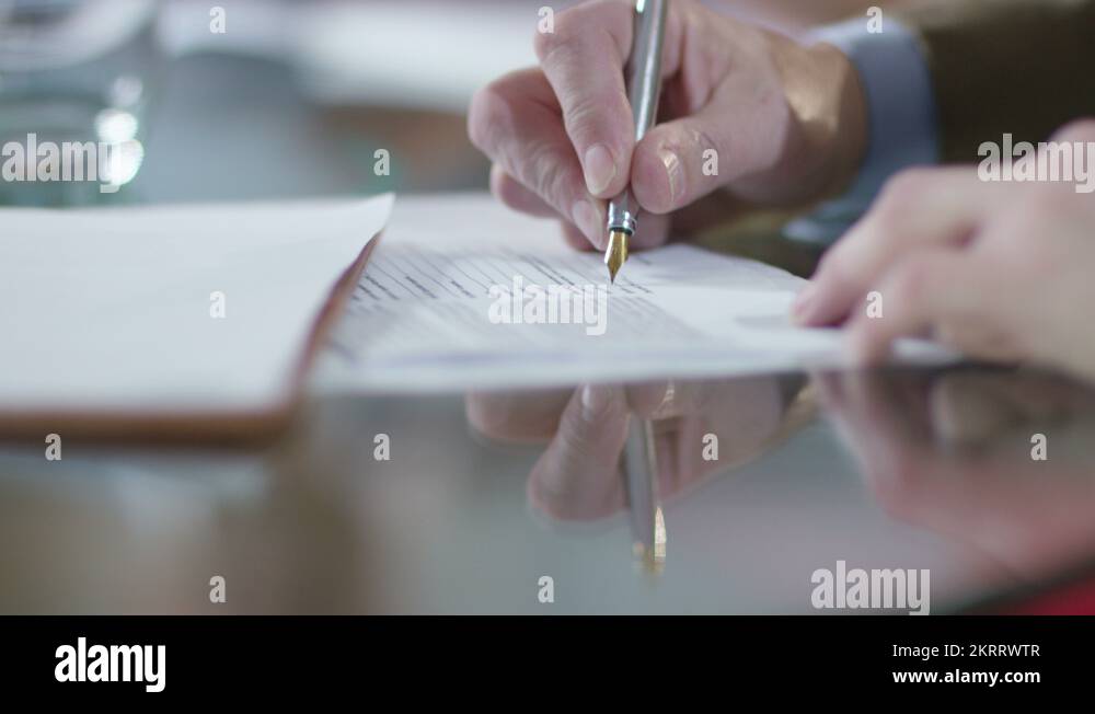 4k Businessman signing contracts and shaking hands to conclude deal ...