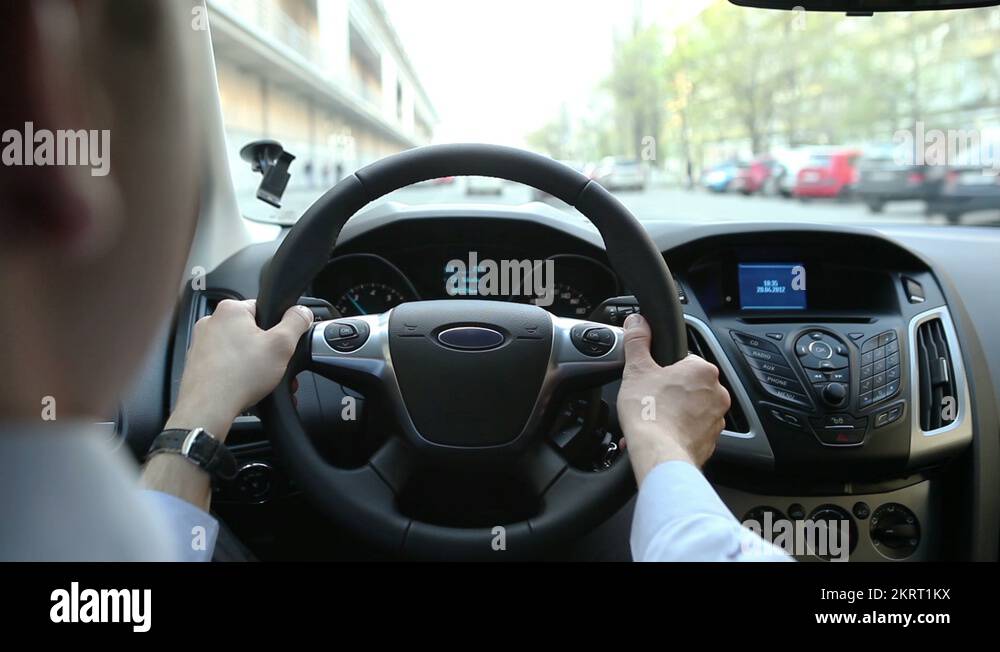 City road ride from drivers point of view hd. Hand on the wheel Stock ...