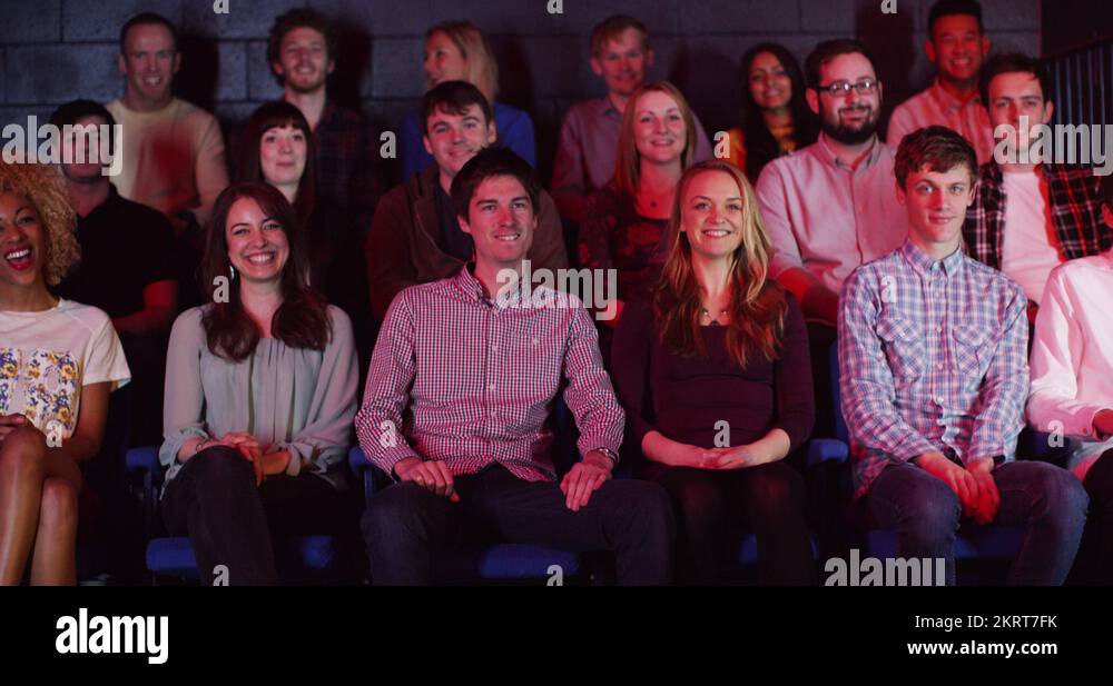 4K Young theatre audience give a standing ovation to the performers on stage Stock Video Footage ...