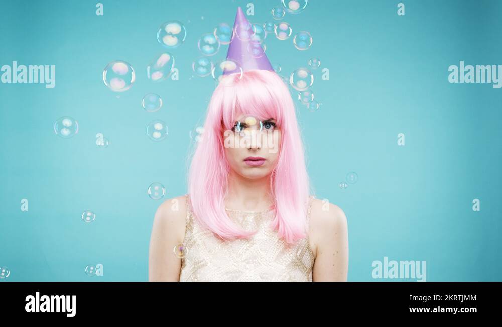 Single woman is sad in bubble shower slow motion photo booth blue ...