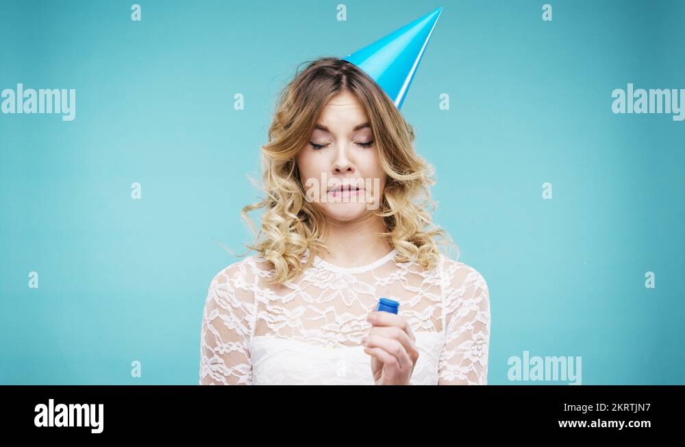 Crazy face woman pulling party popper slow motion photo booth blue ...