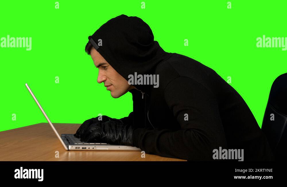 Hacker typing at his desk Stock Video Footage - Alamy