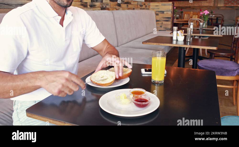 Man buttering bread Stock Videos & Footage - HD and 4K Video Clips - Alamy
