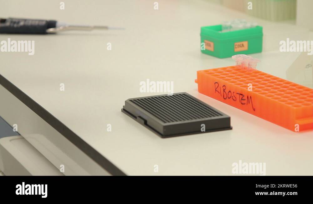 Scientist dropping liquid into vial in genetic laboratory Stock Video ...