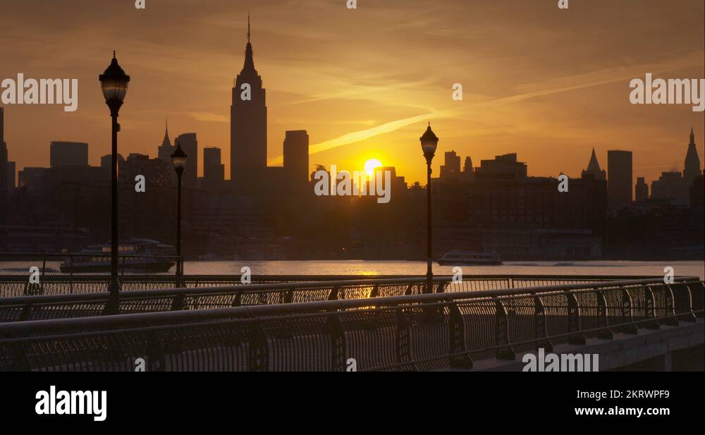 Two passengers ferries traveling on the Hudson River with the sun ...