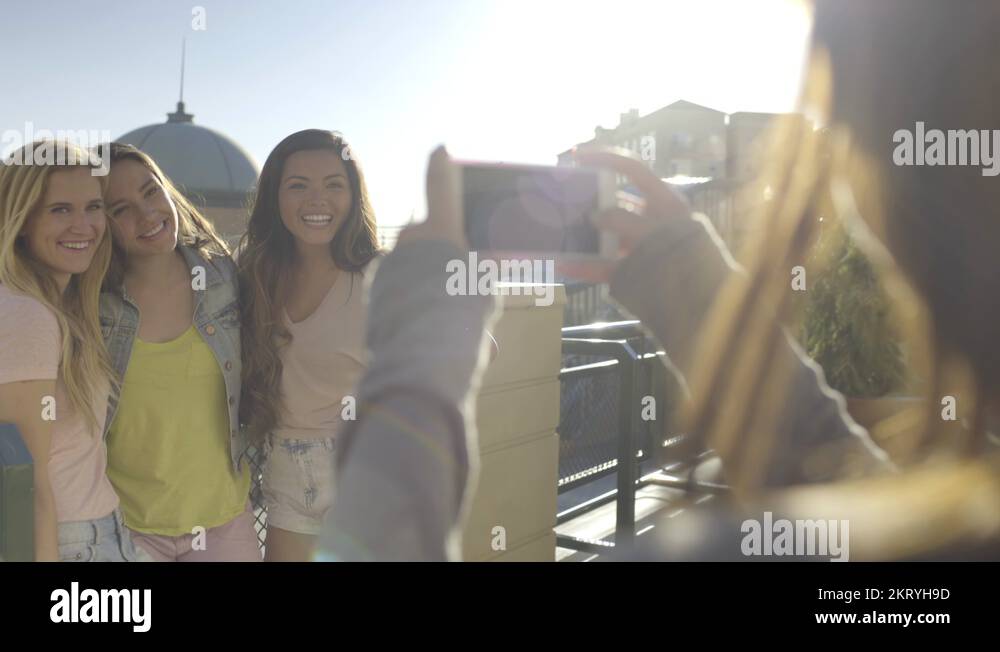 Friends Pose For Photos At An Outdoor Mall, Their Friend Shows Them ...