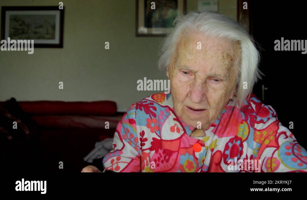 Very Old Lady Reading A Book With A Magnifying Glass, Poor Vision, Tilt ...