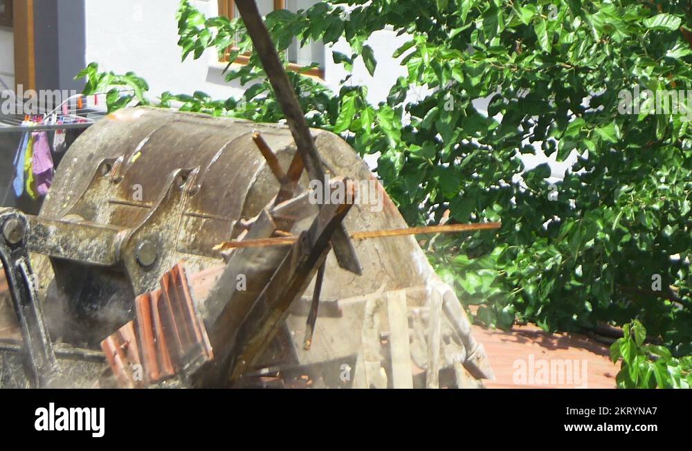 Slow motion of falling down broken roof tiles and planks during ...